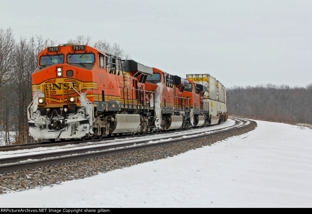 BNSF 7675 Leads Wb stack train.